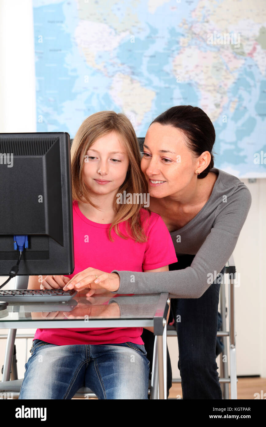 Grade-school girl in class with teacher Stock Photo - Alamy