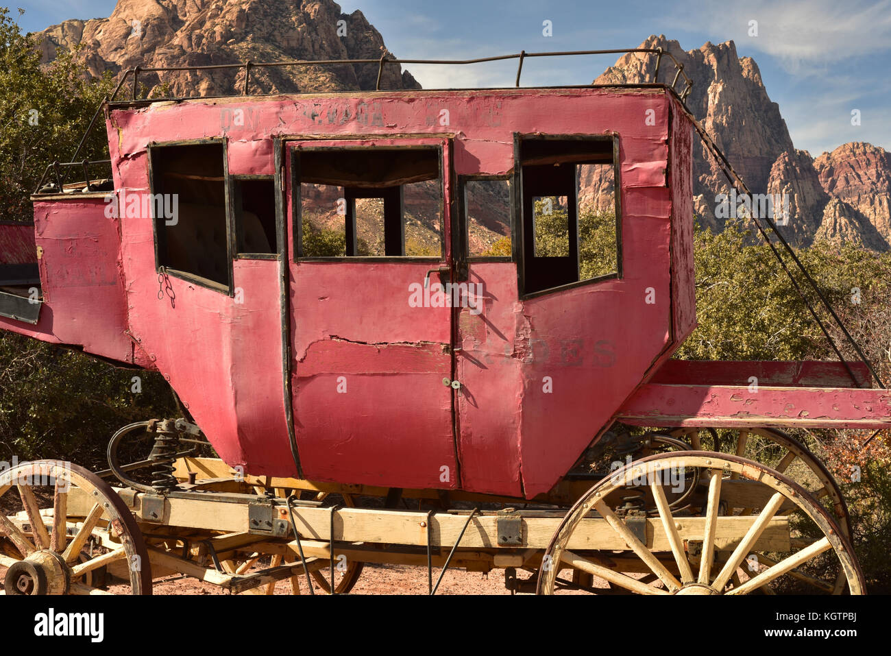red Old West stage coach in desert landscape Stock Photo - Alamy
