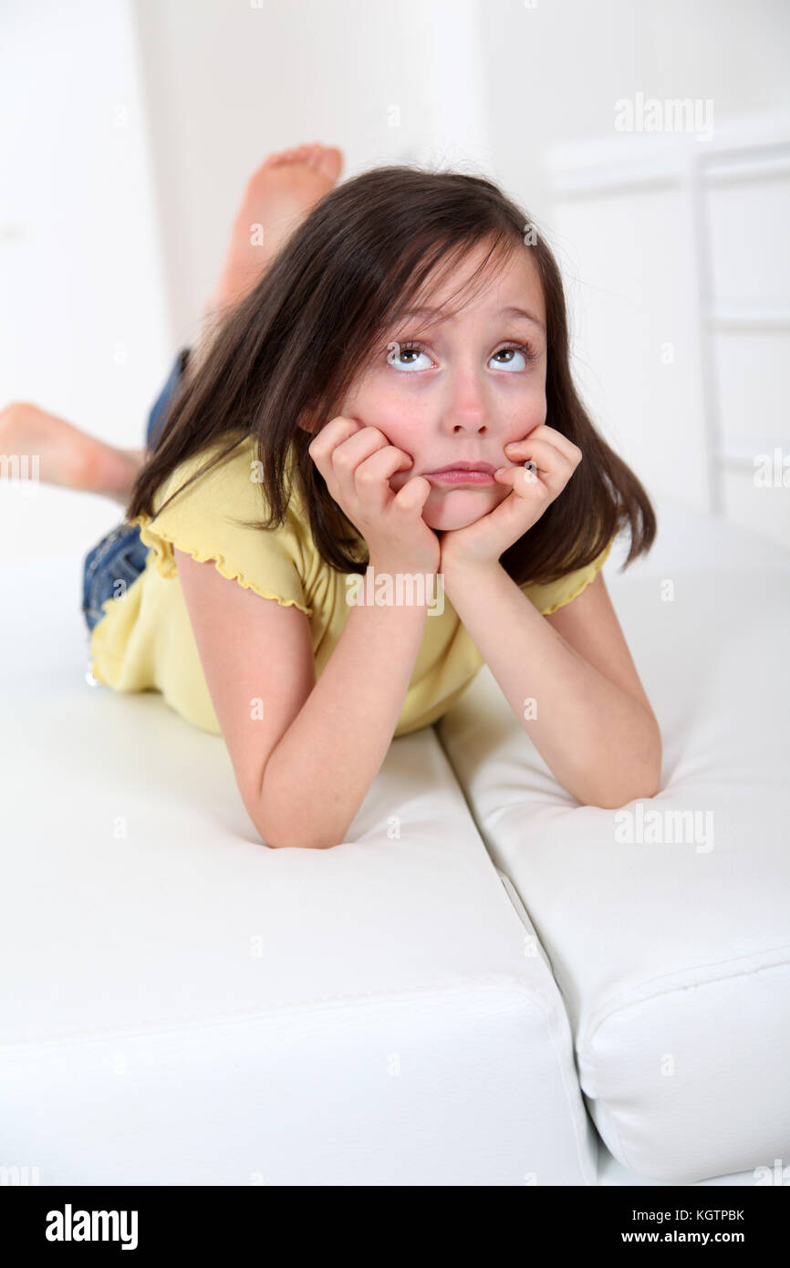 Portrait of little girl with bored expression Stock Photo - Alamy