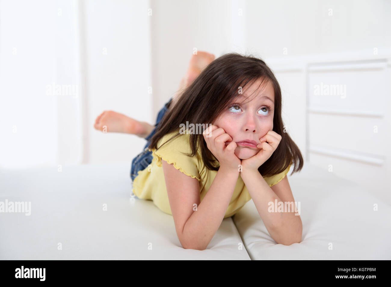 Portrait of little girl with bored expression Stock Photo - Alamy