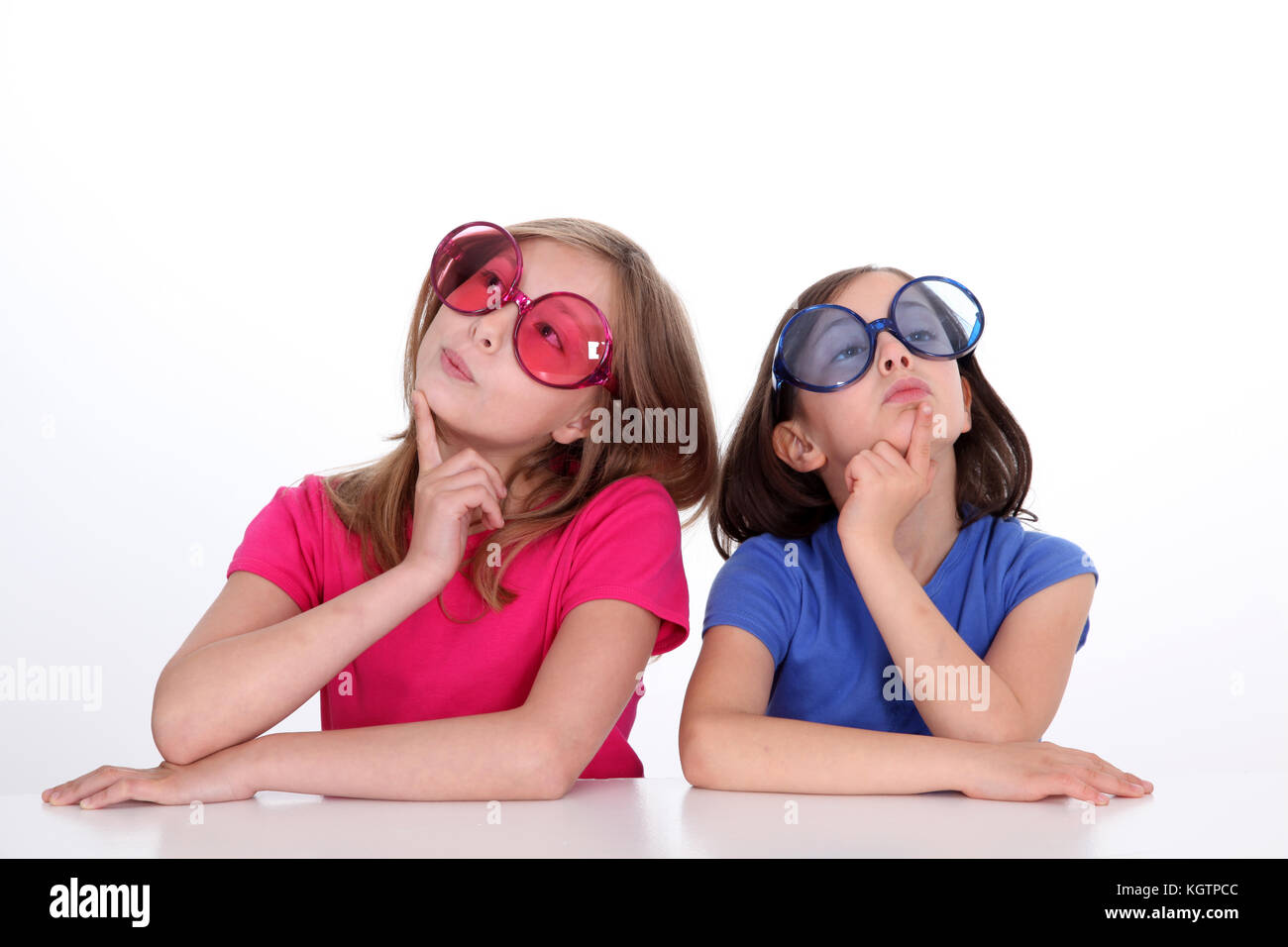 Portrait of sisters being imaginative Stock Photo - Alamy