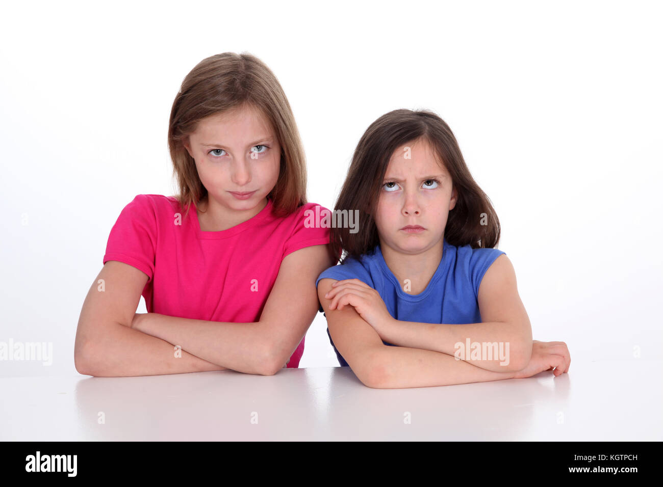 Girls with serious expression on white background Stock Photo - Alamy