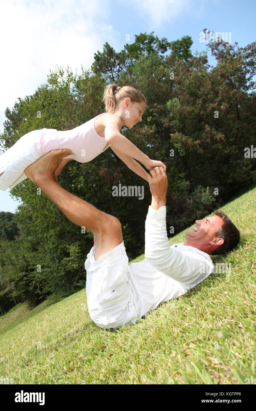 Father and child playing in park Stock Photo - Alamy