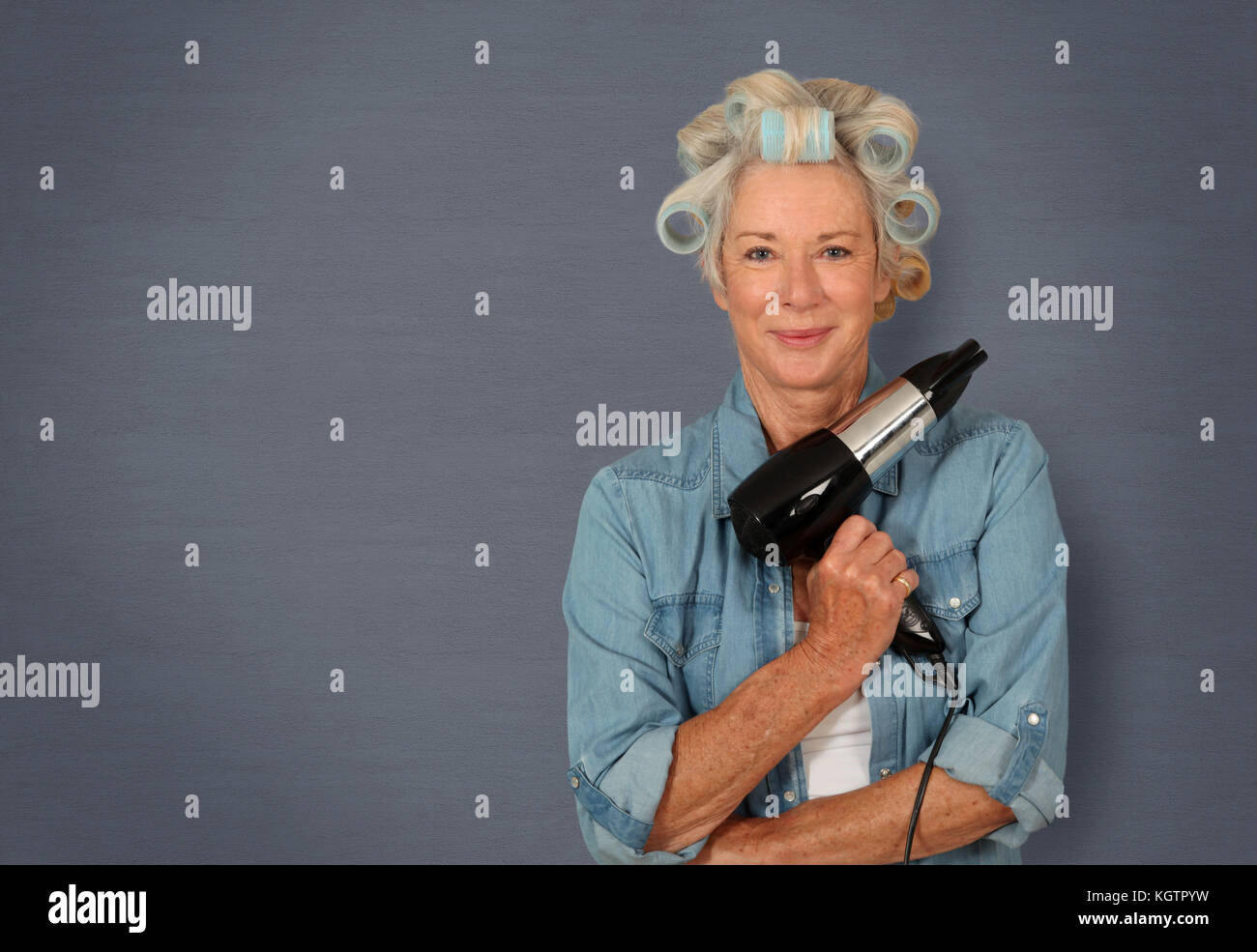 Portrait of senior woman with hair-curlers Stock Photo - Alamy