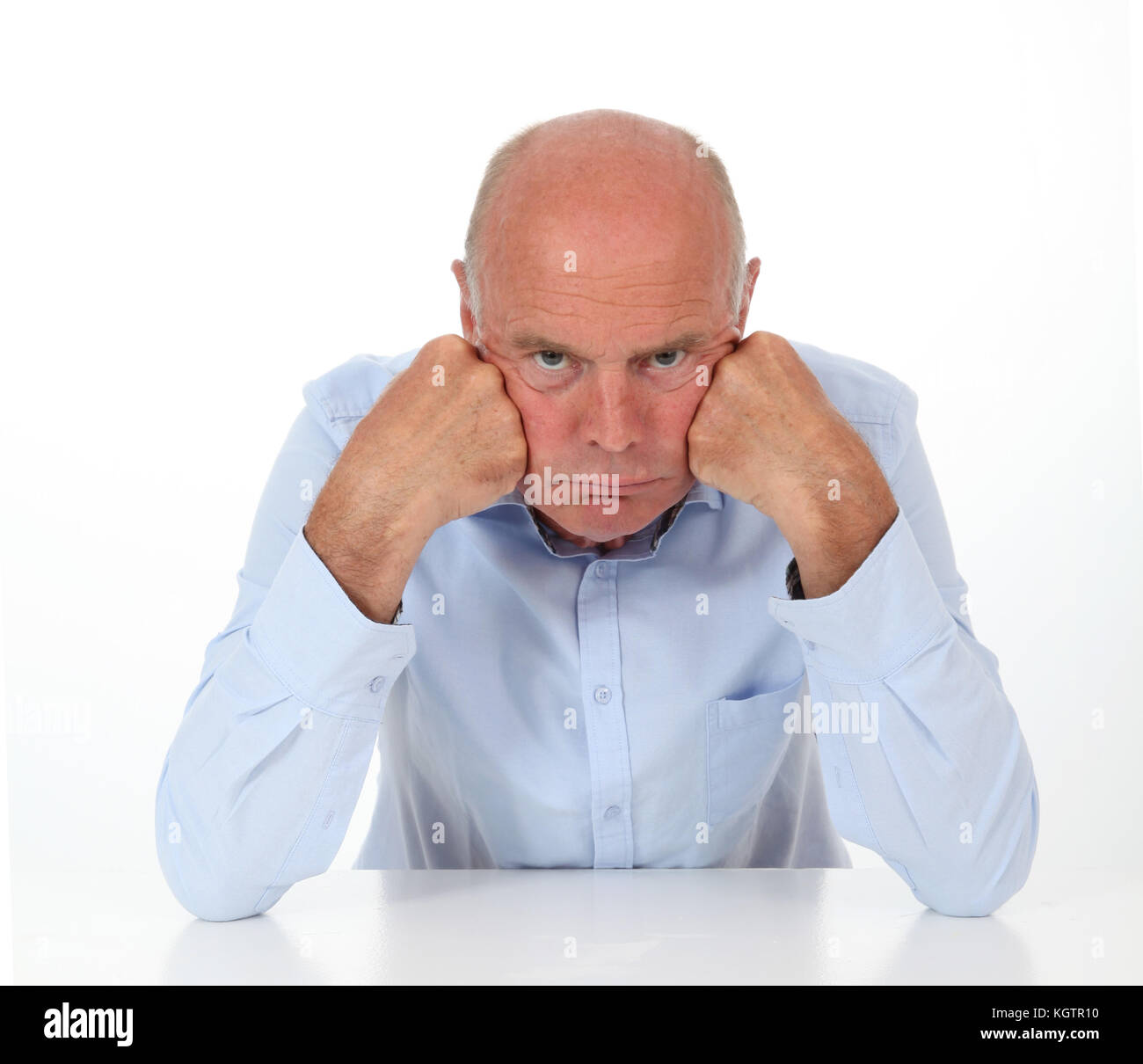 Senior man being grouchy Stock Photo - Alamy
