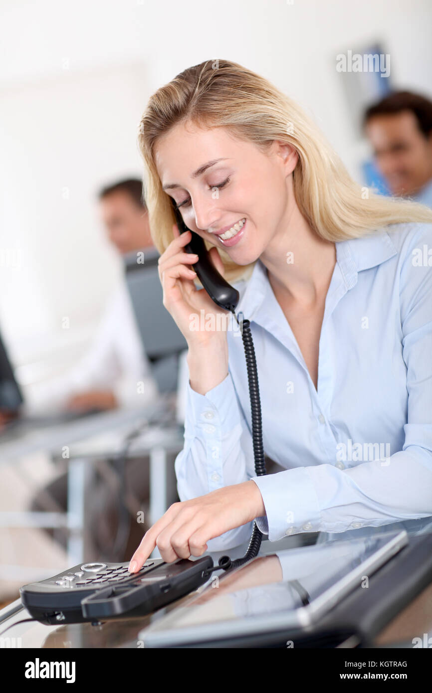 Office worker talking on the phone Stock Photo - Alamy