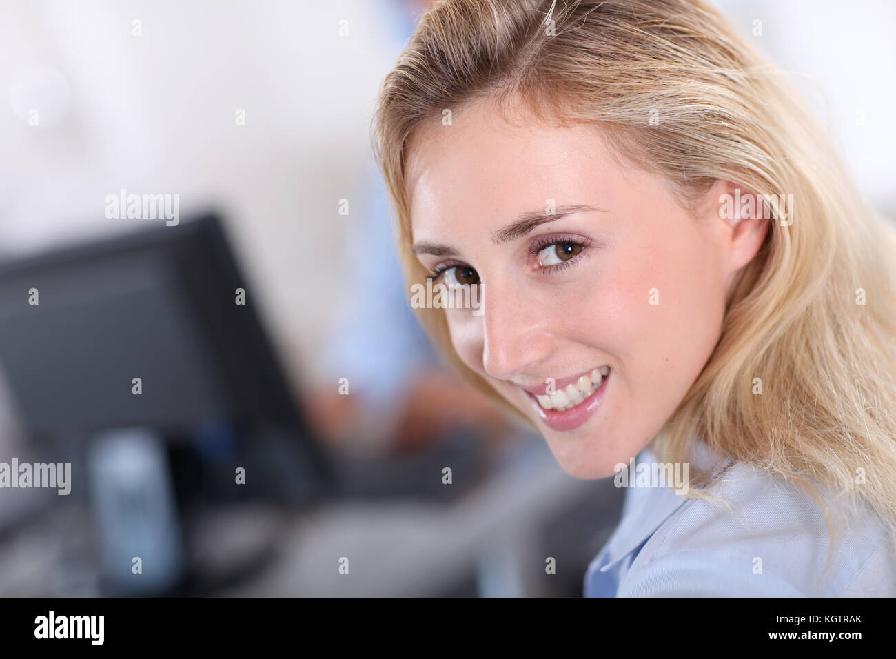 Portrait of smiling office worker Stock Photo - Alamy