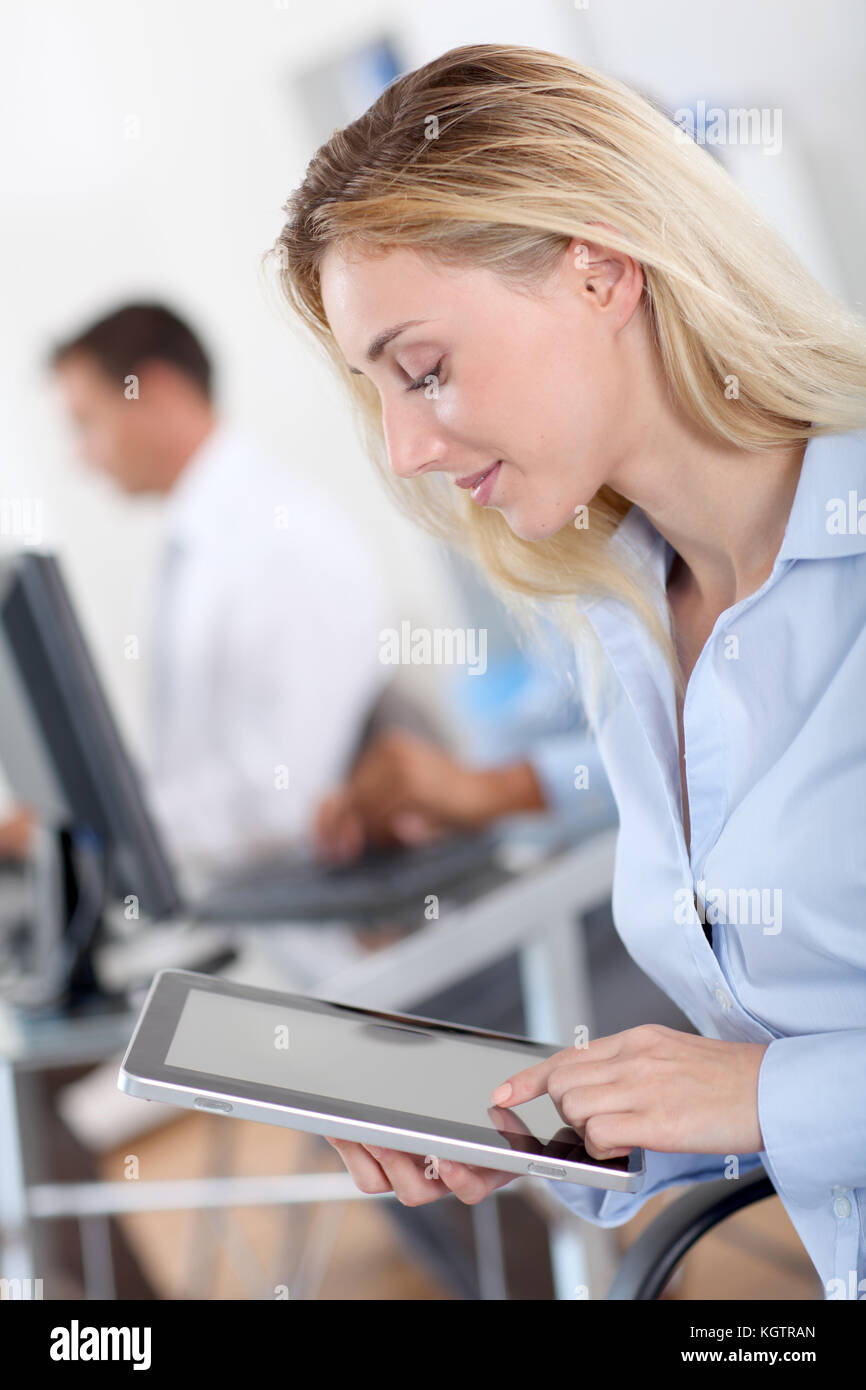 Protrait of office worker using electronic tablet Stock Photo - Alamy