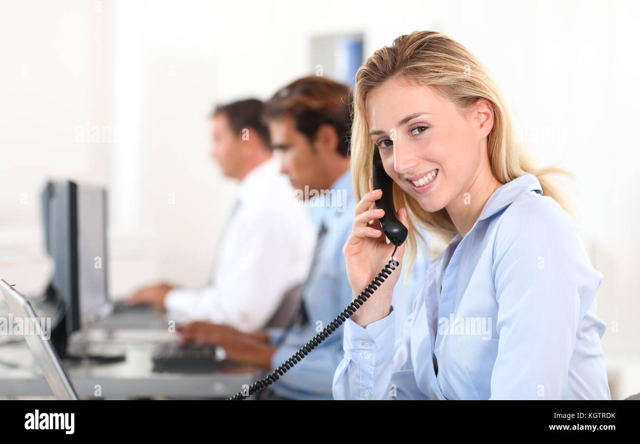 Office worker answering the phone Stock Photo - Alamy