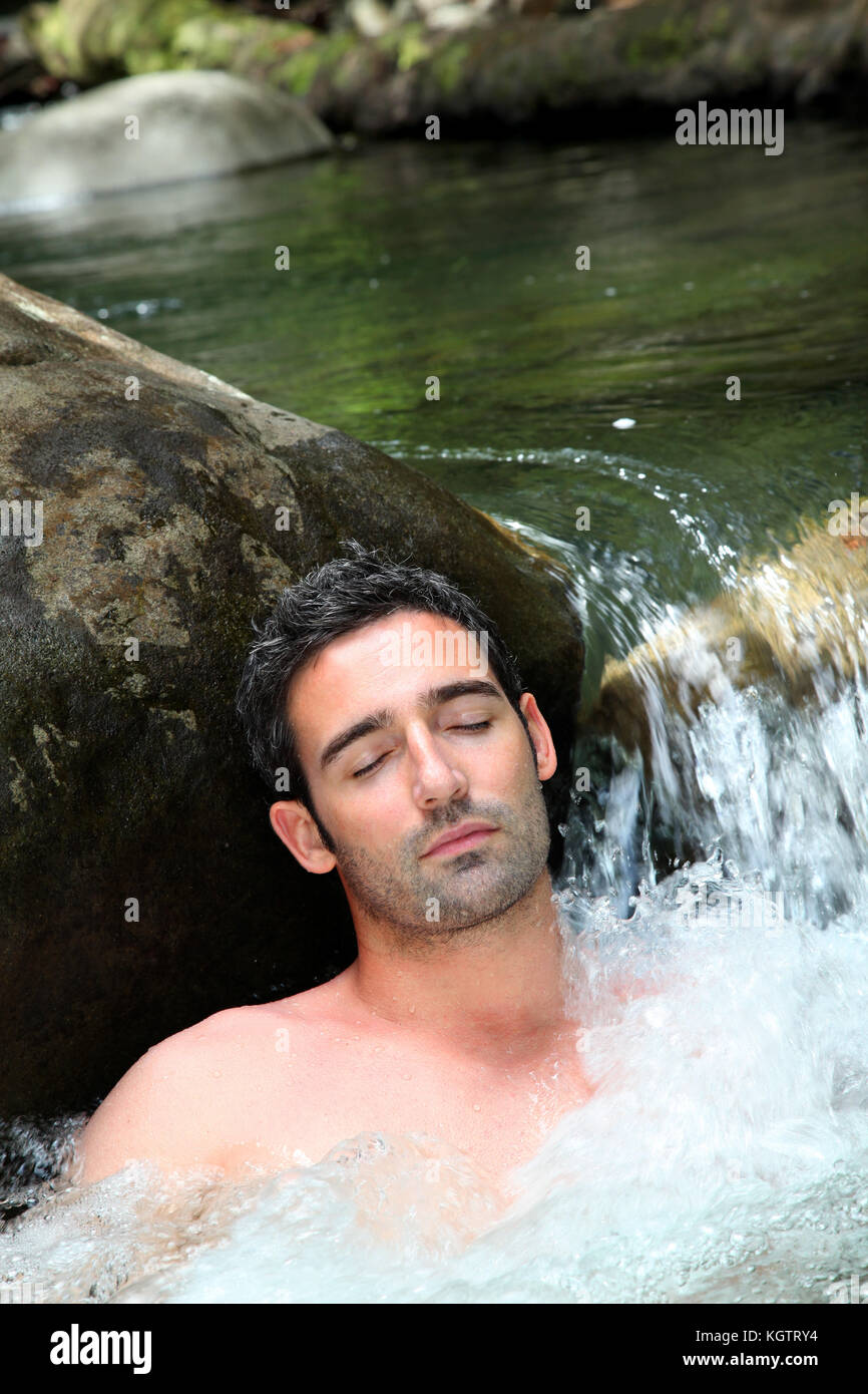 Closeup of man relaxing in natural river spa Stock Photo - Alamy