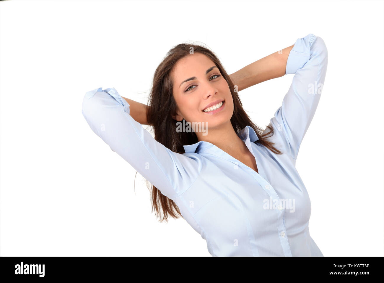 Beautiful relaxed woman with arms behing head Stock Photo - Alamy