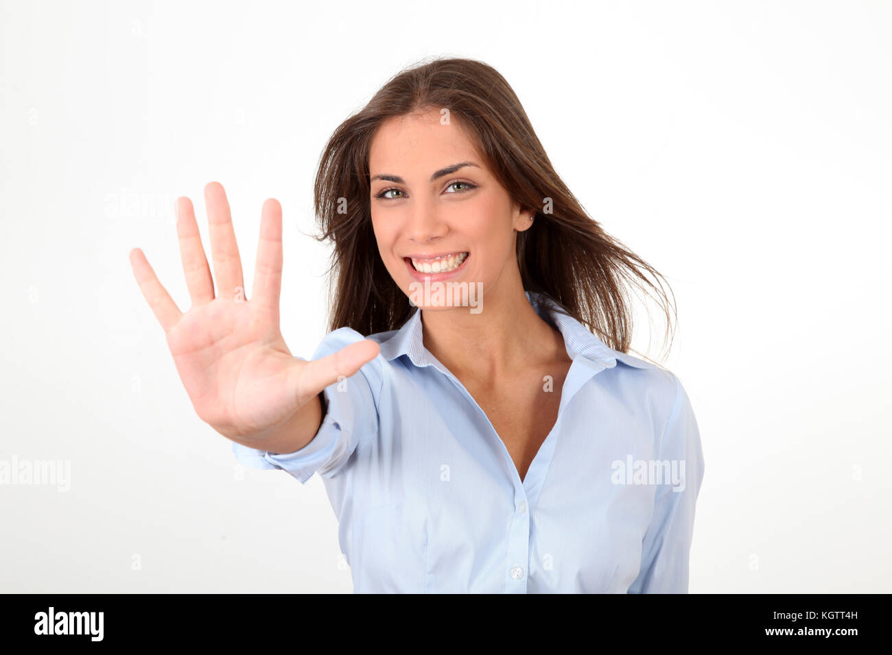 Portrait of girl showing hand to camera Stock Photo - Alamy