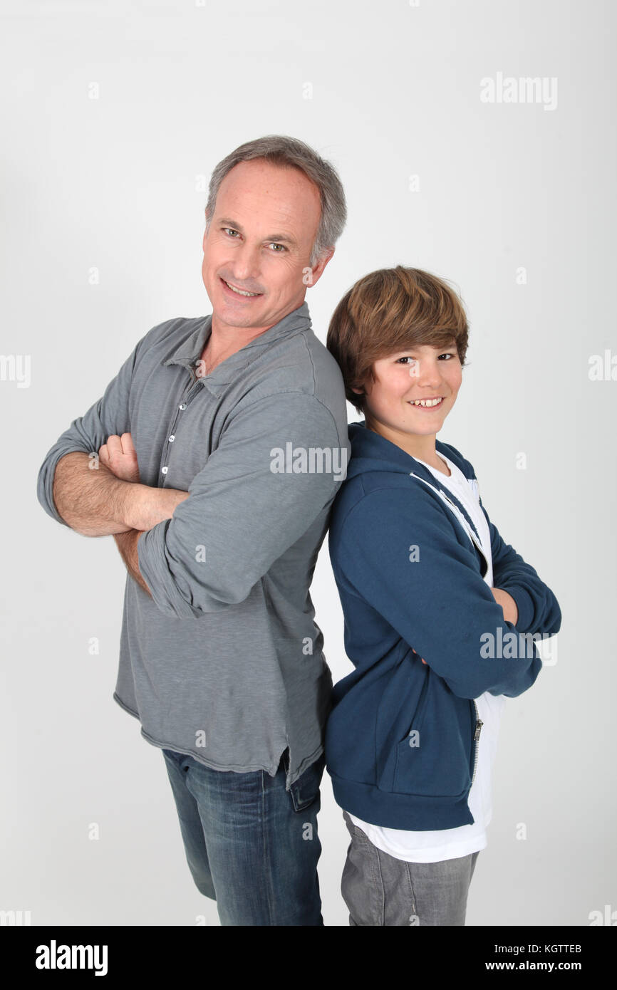 Father and son standing on white background Stock Photo - Alamy
