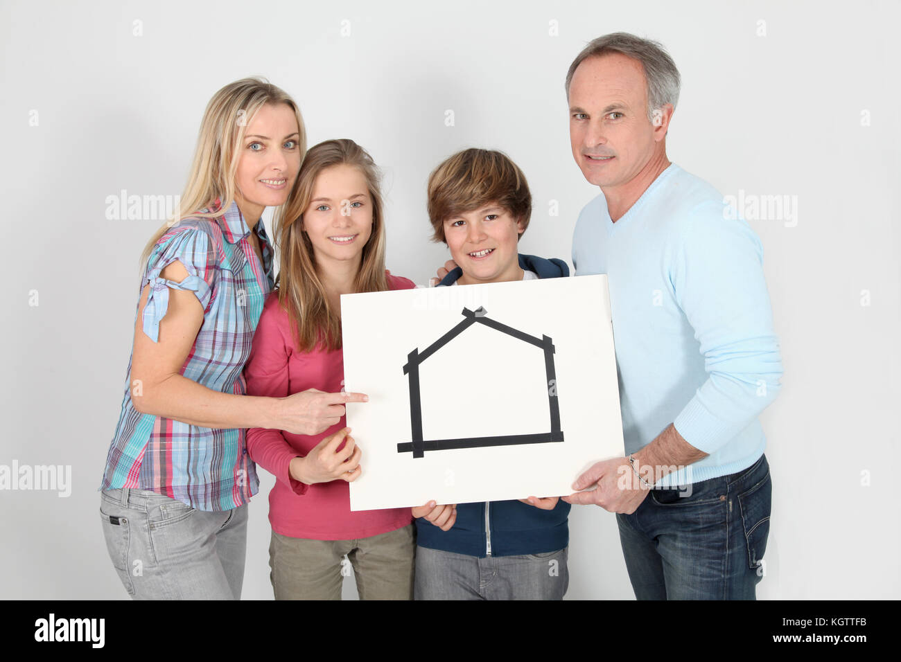 Portrait of happy family holding message board Stock Photo - Alamy