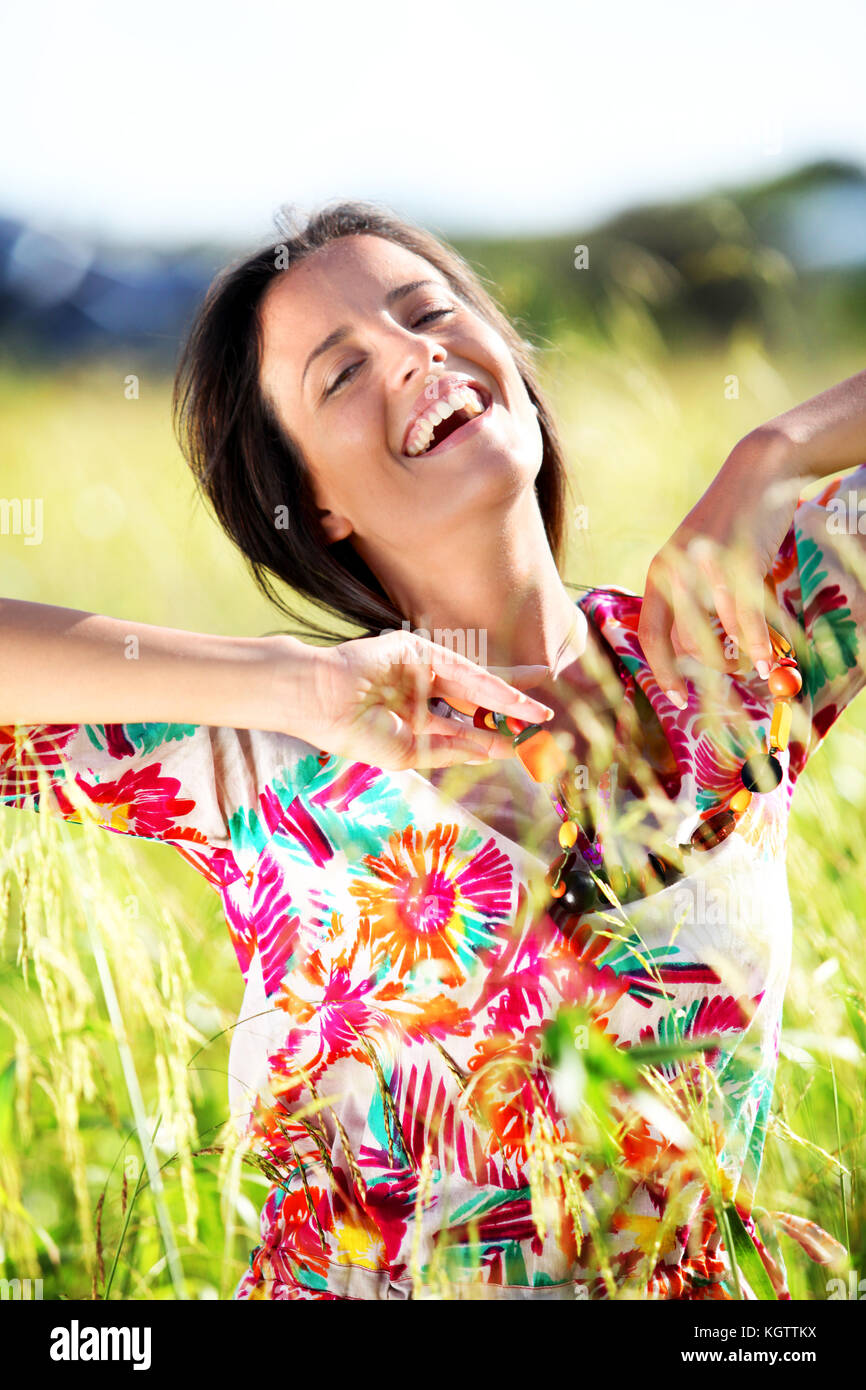 Beautiful woman in country field Stock Photo - Alamy