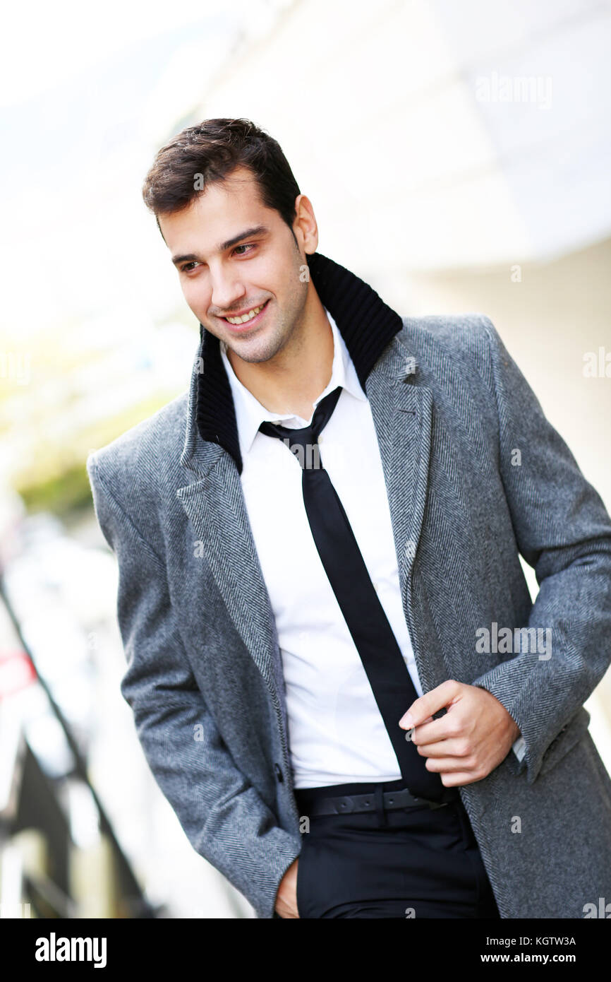 Trendy active man walking in town Stock Photo - Alamy