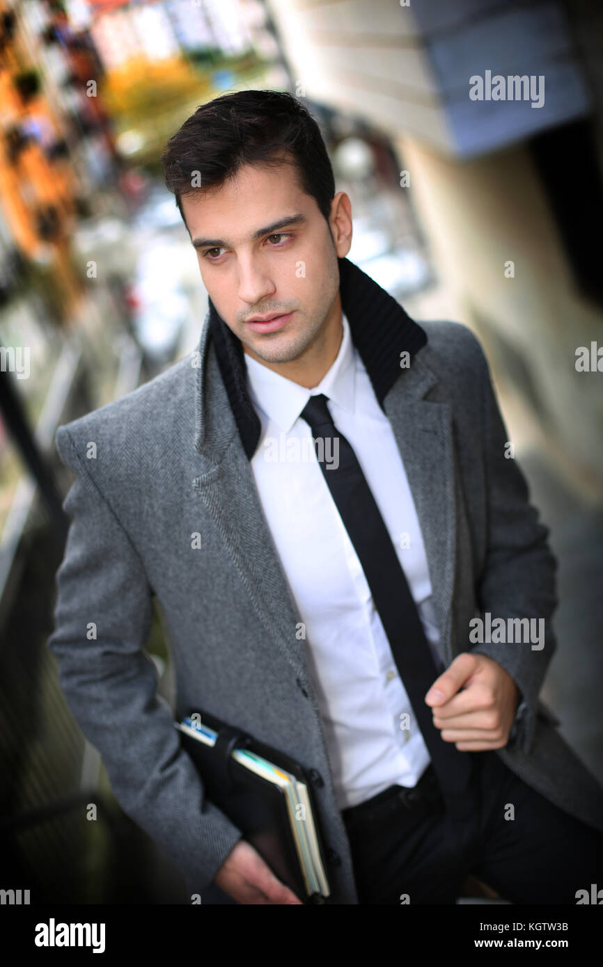 Trendy active man walking in town Stock Photo - Alamy