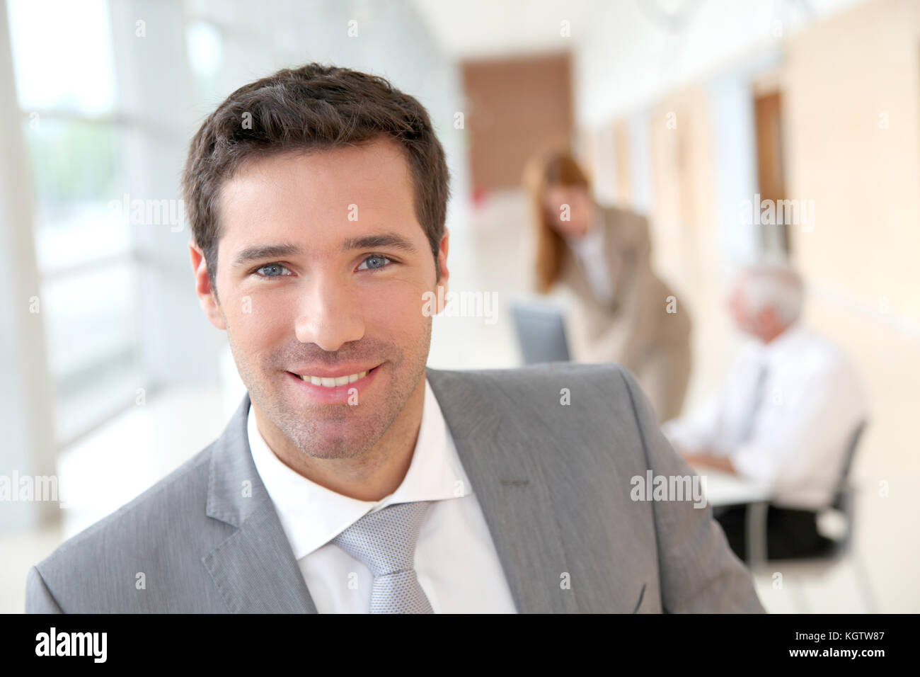 Portrait of smiling businessman Stock Photo - Alamy