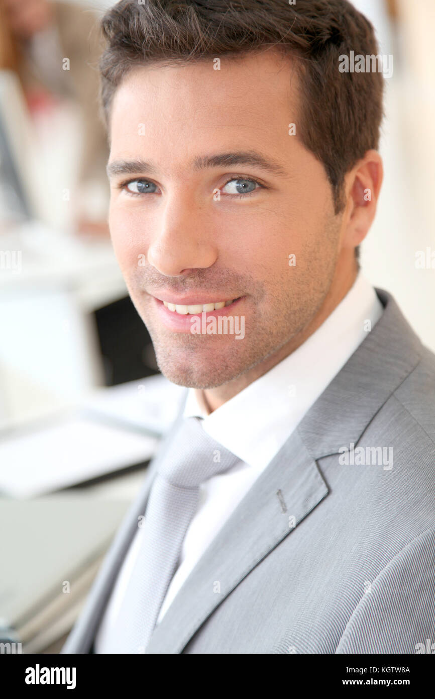 Portrait of smiling businessman Stock Photo - Alamy