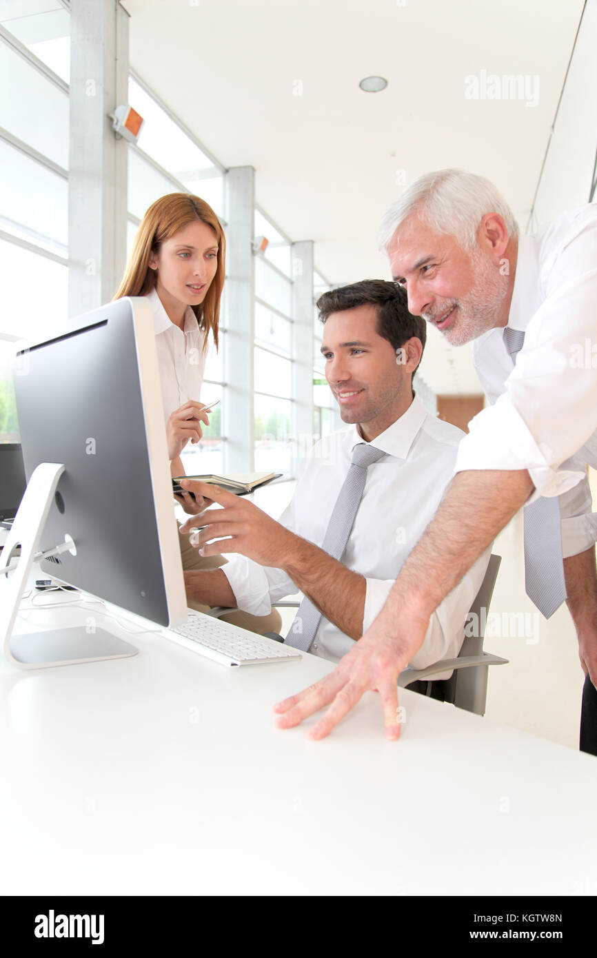 Office workers with manager in a meeting Stock Photo - Alamy