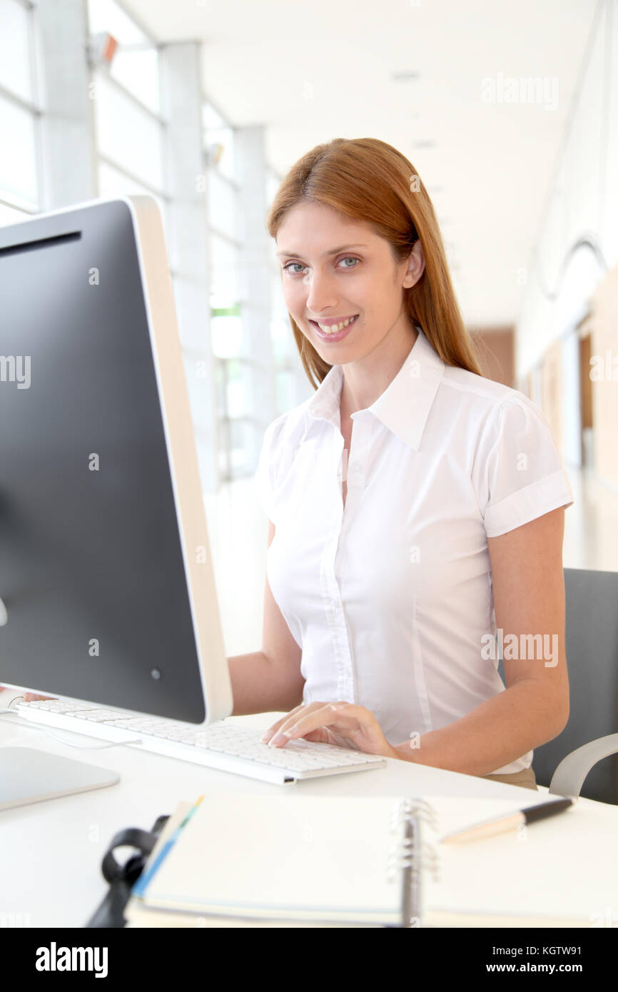 Office worker in front of desktop computer Stock Photo - Alamy