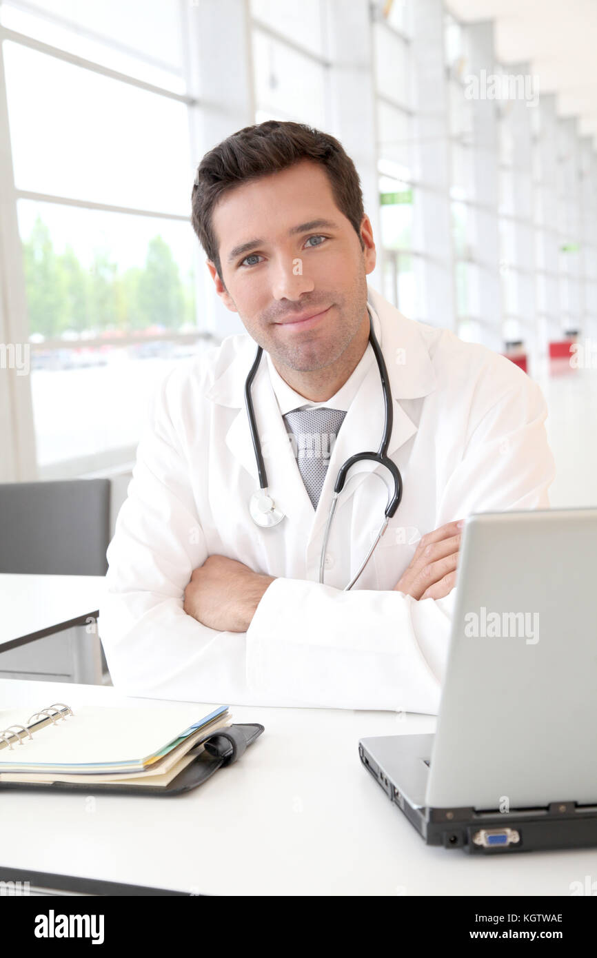 Portrait of young doctor at work Stock Photo - Alamy