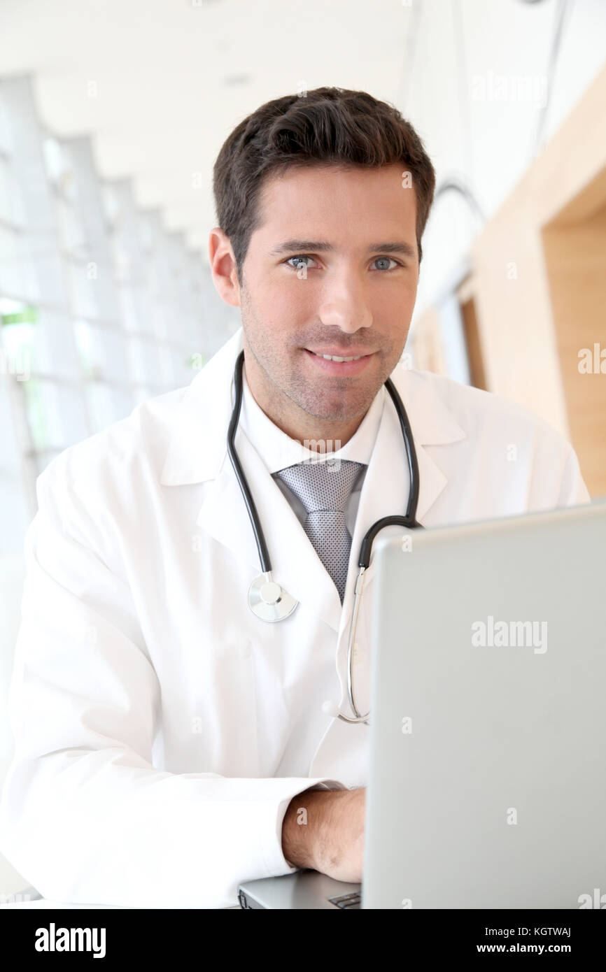 Portrait of young doctor at work Stock Photo - Alamy