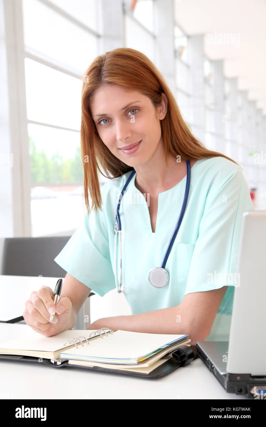 Nurse working on laptop computer in hospital Stock Photo - Alamy