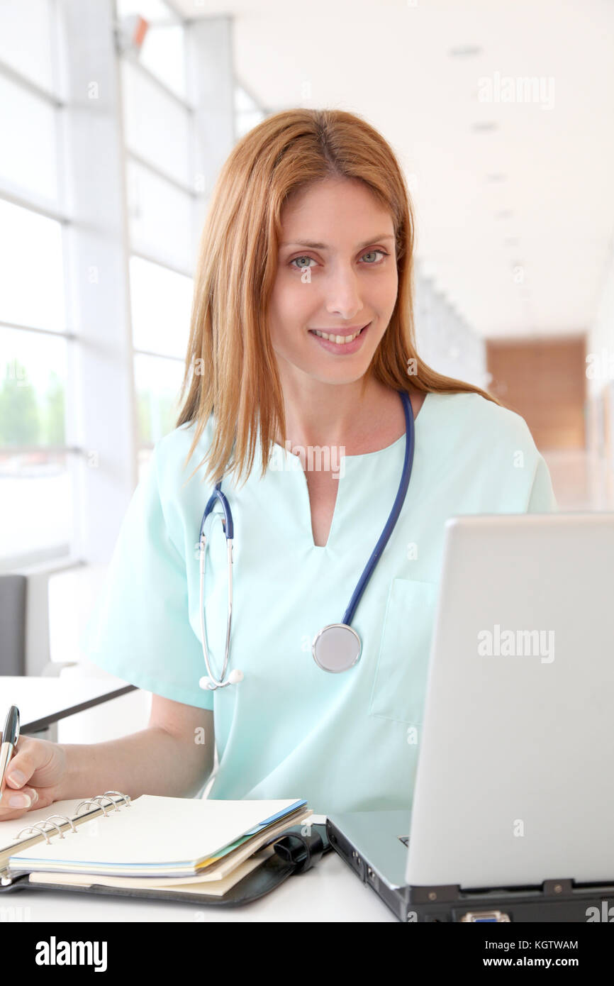 Nurse working on laptop computer in hospital Stock Photo - Alamy