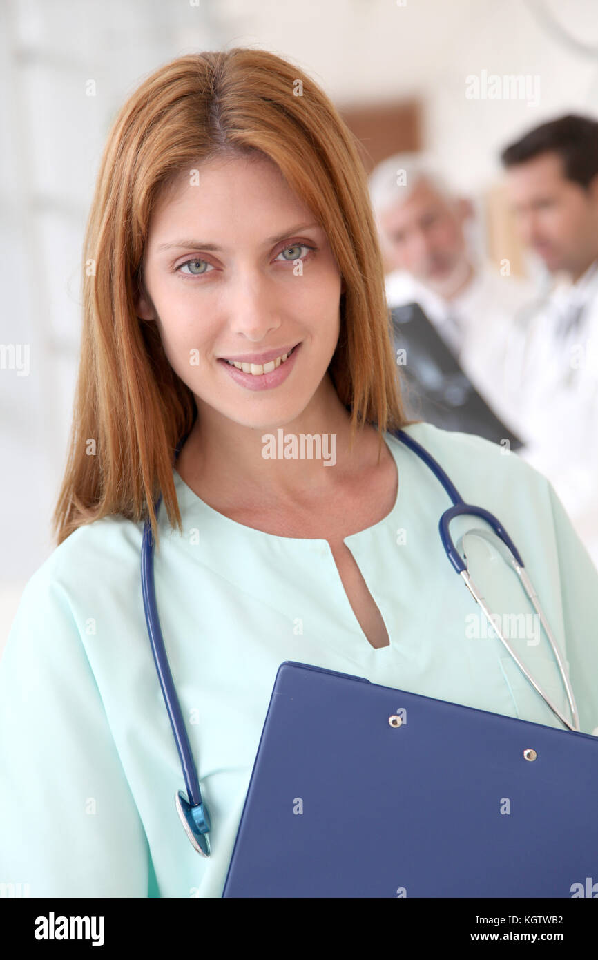 Portrait of beautiful nurse standing in hospital Stock Photo - Alamy