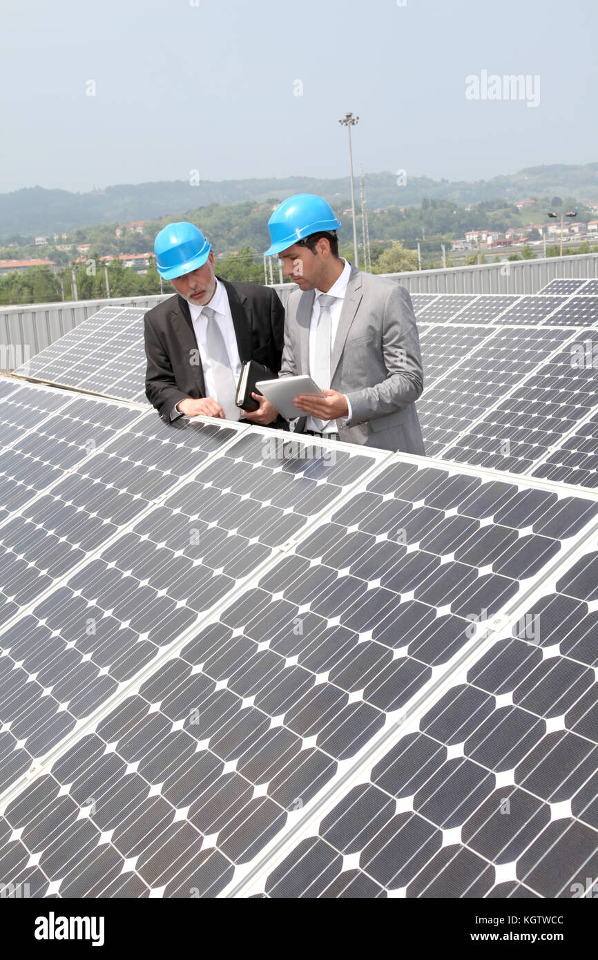 Engineers checking solar panels setup hi-res stock photography and ...