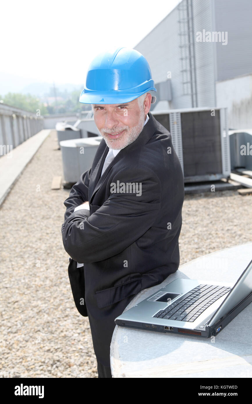 Businessman checking industrial site Stock Photo - Alamy
