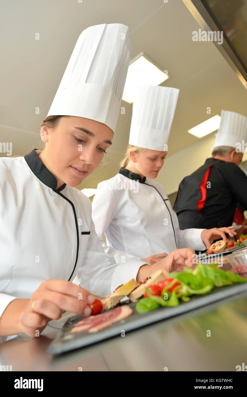 Young people in cooking training class Stock Photo - Alamy