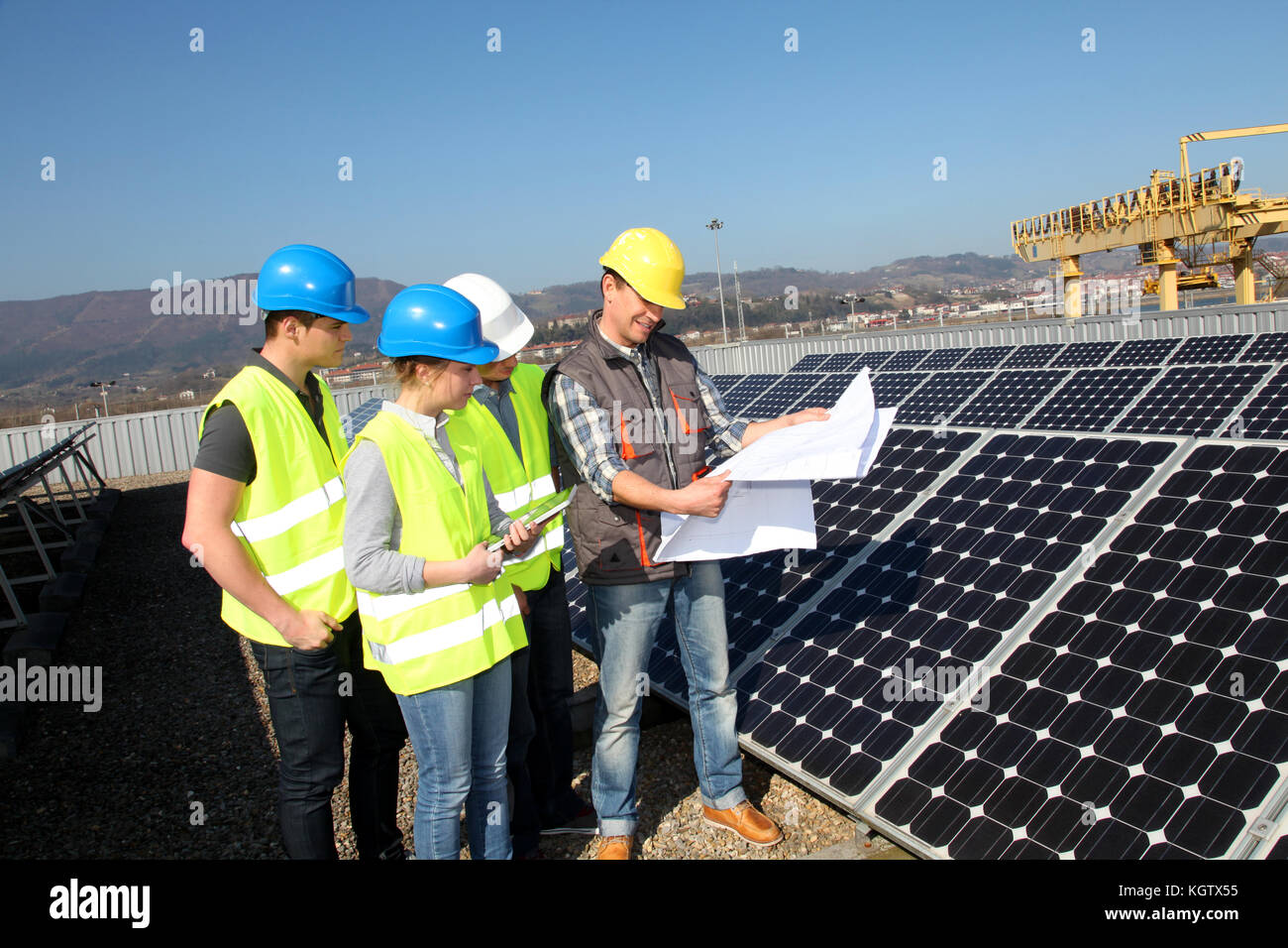 Engineering professional with group of students in training Stock Photo ...