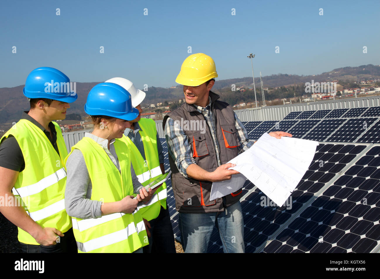 Engineering professional with group of students in training Stock Photo ...
