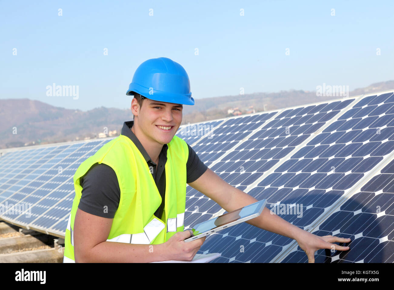Young adult doing professional training on solar panels plant Stock ...