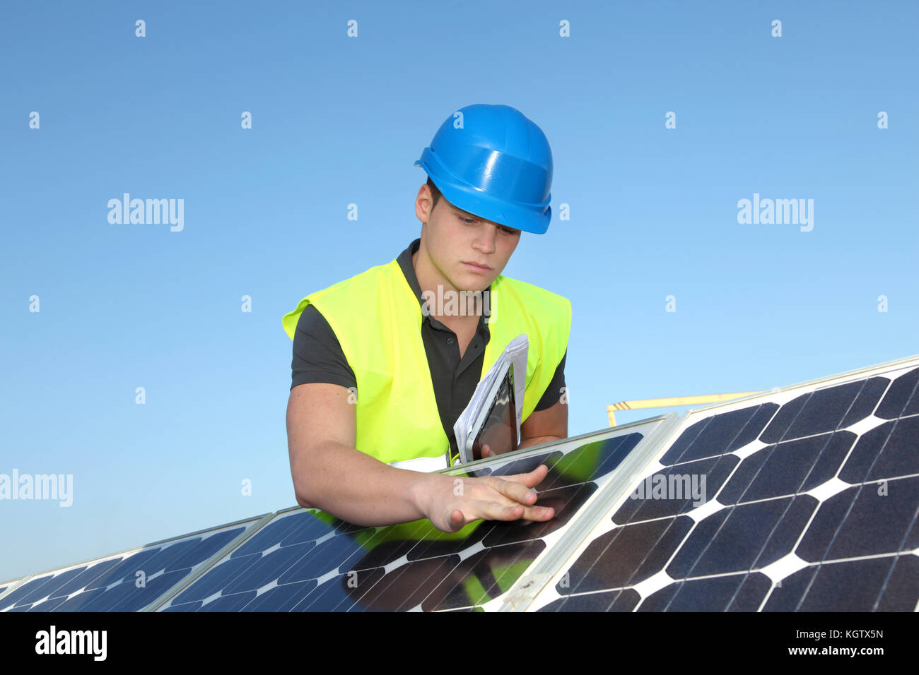Young adult doing professional training on solar panels plant Stock ...