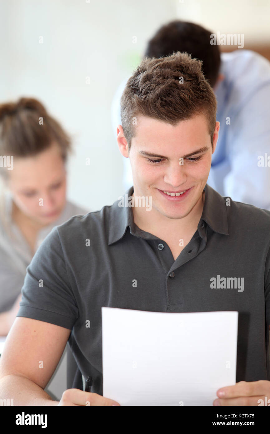 Portrait of student boy doing written exam Stock Photo - Alamy