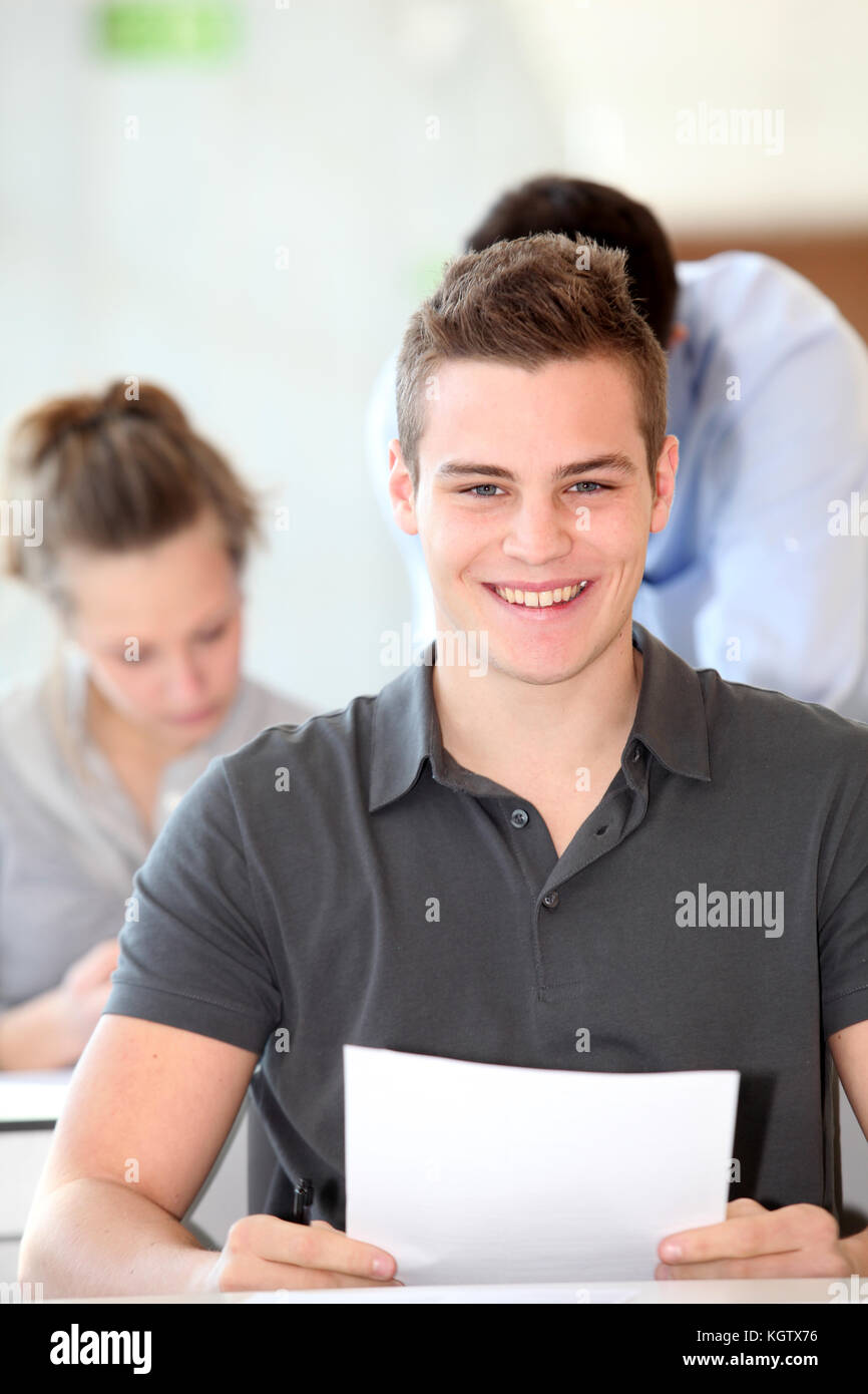 Portrait of student boy doing written exam Stock Photo - Alamy