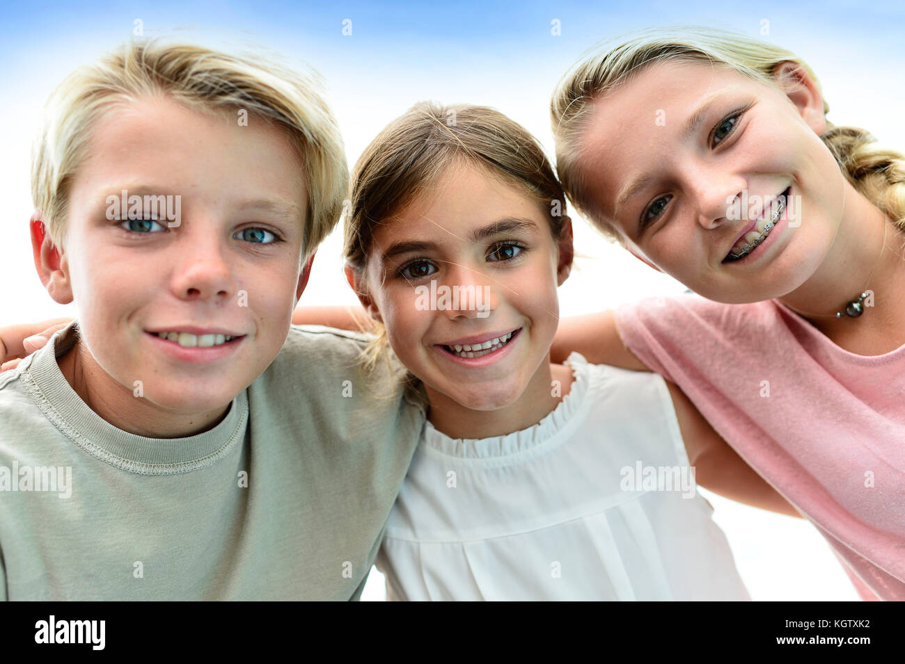 Portrait of kids with arms around each other Stock Photo - Alamy