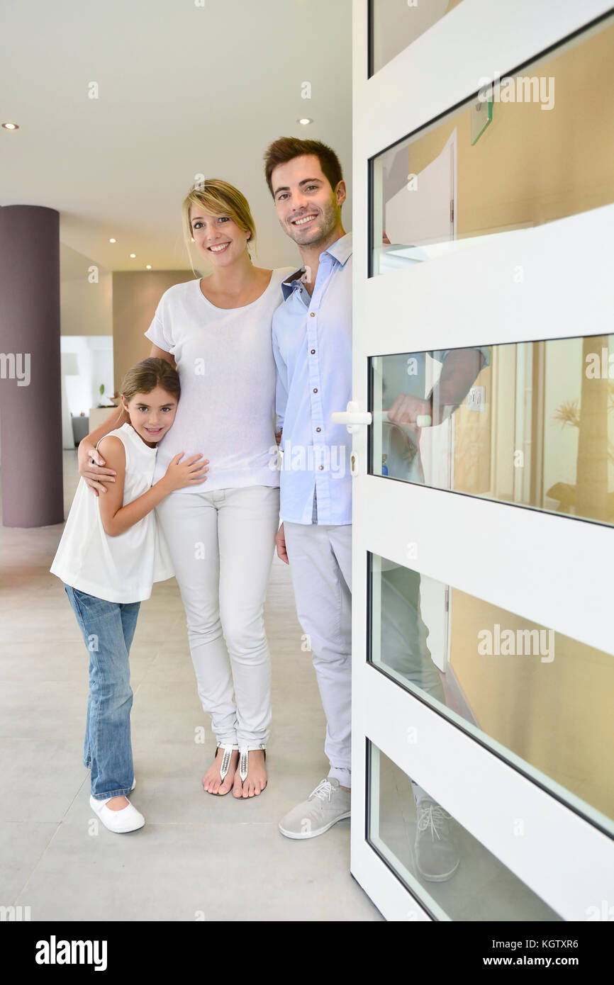 Woman opening front door man hi-res stock photography and images - Alamy