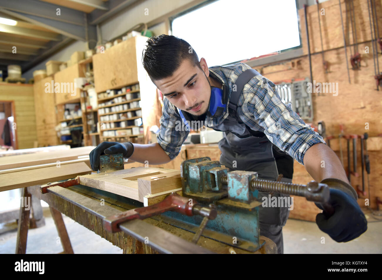 Young man in woodwork training course Stock Photo - Alamy