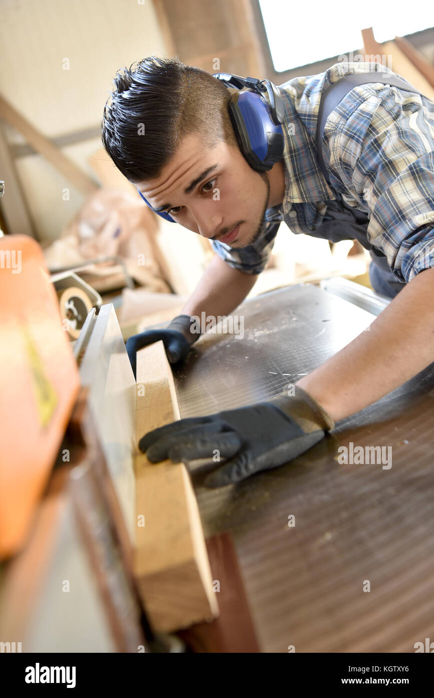 Young man in woodwork training course Stock Photo - Alamy