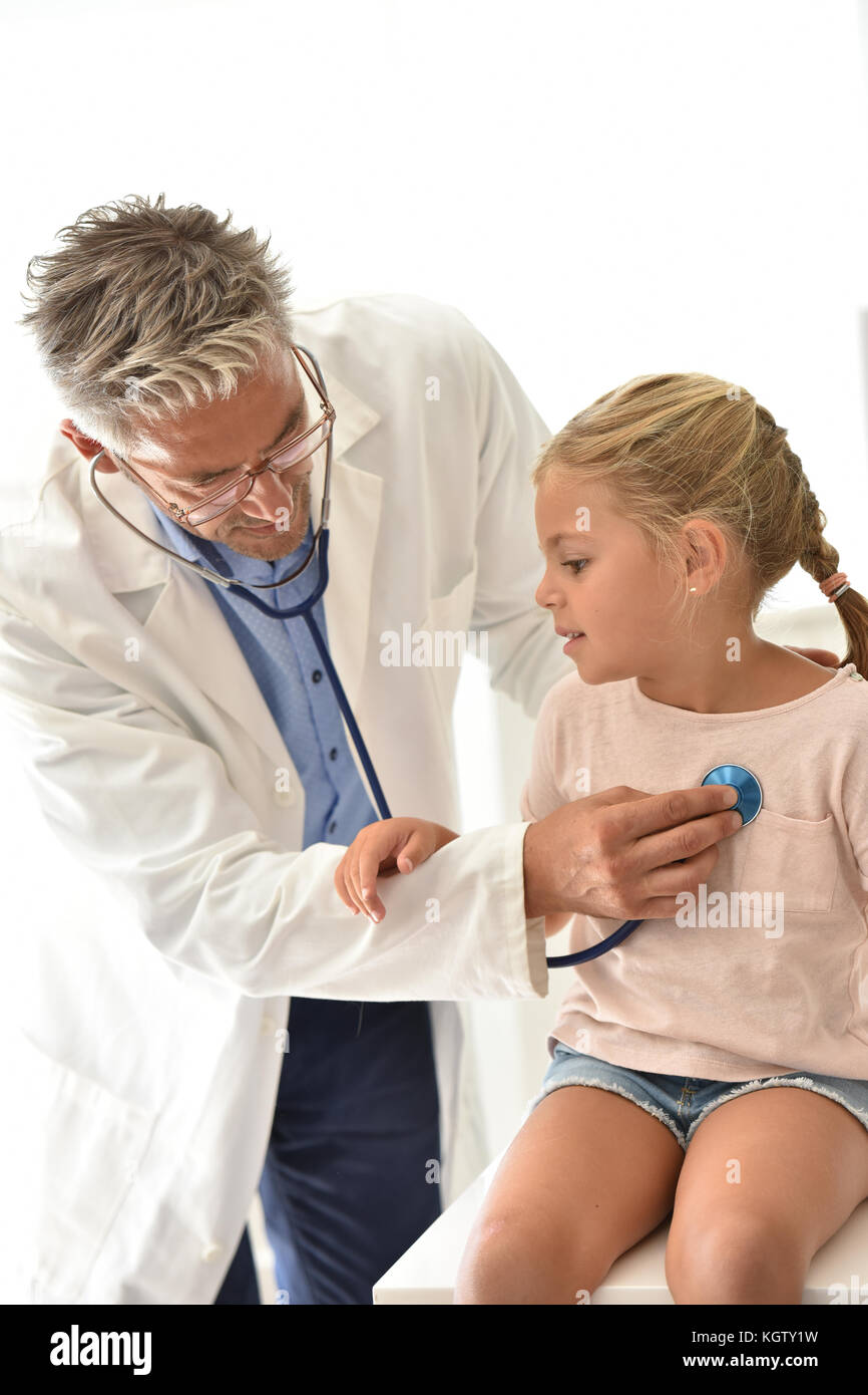Doctor examining little girl with stethoscope Stock Photo - Alamy