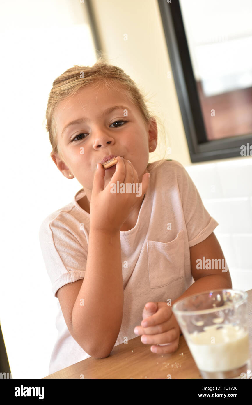 Little girl at home having a snack Stock Photo - Alamy