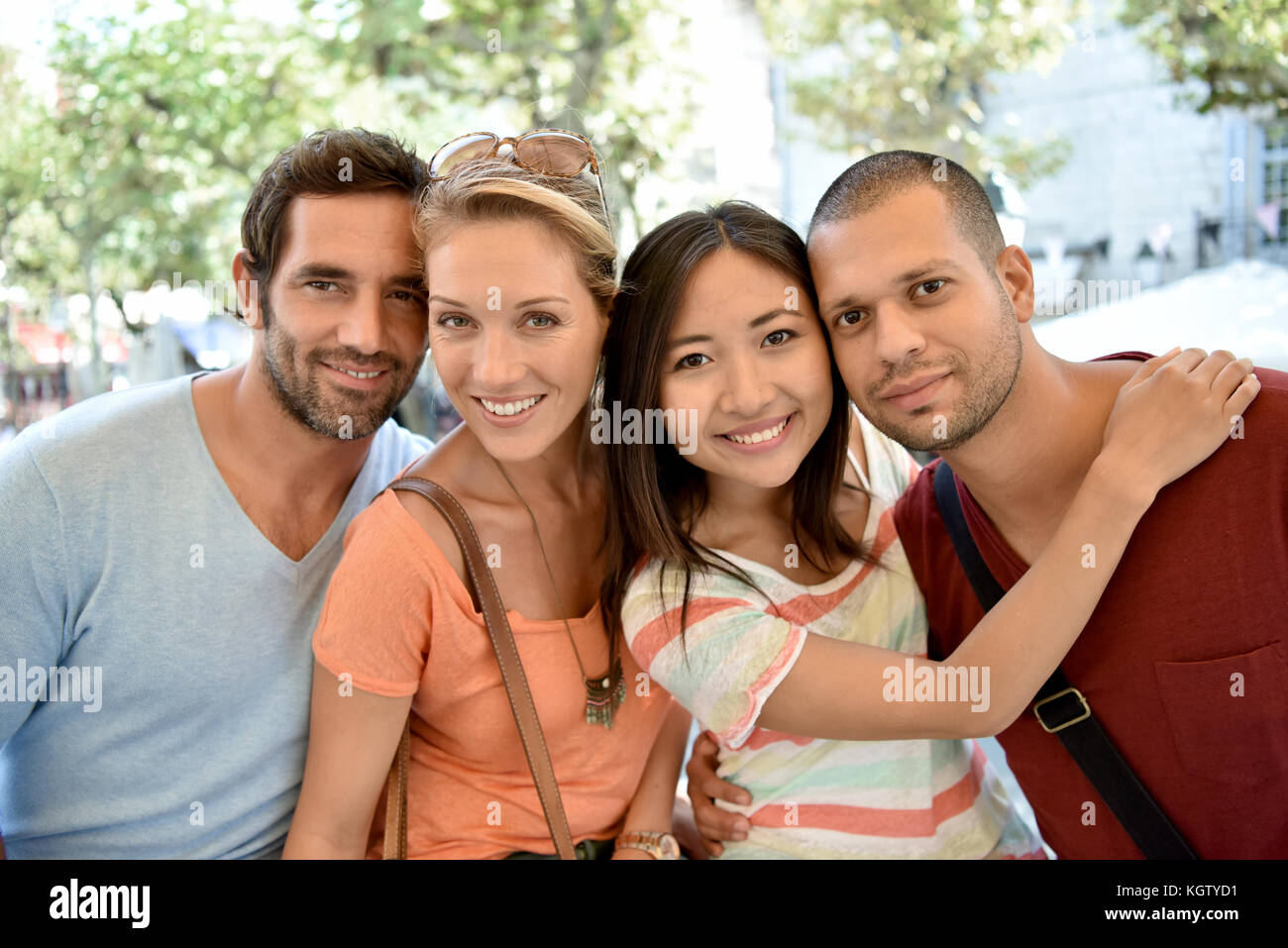 Portrait of friends being happy together, summertime Stock Photo - Alamy