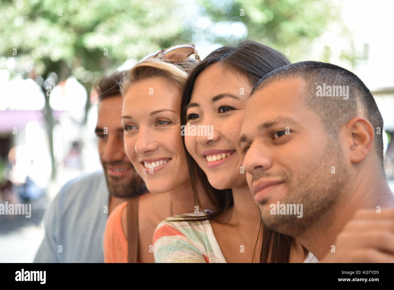 Portrait of friends being happy together, summertime Stock Photo - Alamy