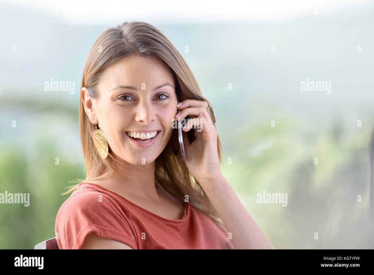 Attractive happy laughing woman talking hi-res stock photography and images - Alamy