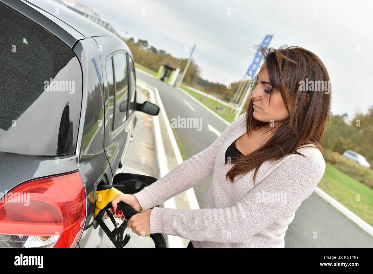 Woman filling up car fuel hi-res stock photography and images - Alamy
