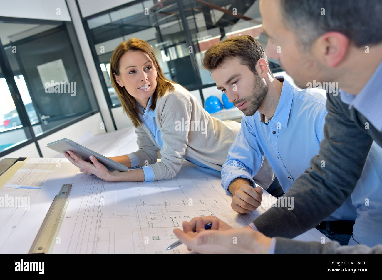 Team of architects working on construction project Stock Photo - Alamy